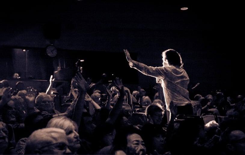 crowd singing tribute